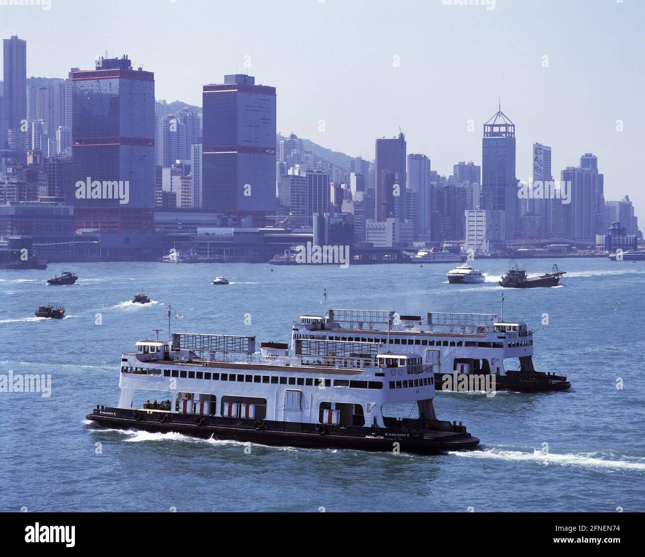 Two Star Ferry ferries in front of the skyscrapers of the Victoria ...