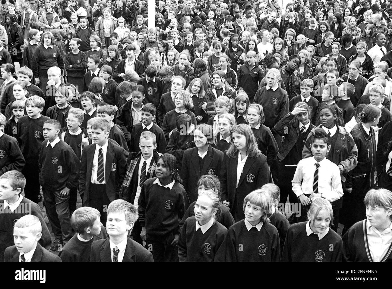 English students in uniform at an outdoor assembly. [automated ...