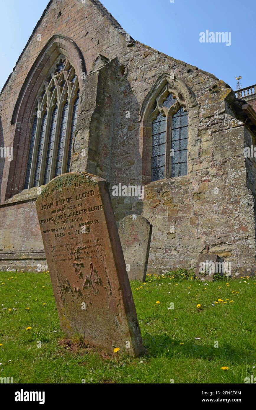 A leaning and weathered gravestone at St Peter's Church, Chelmarsh ...