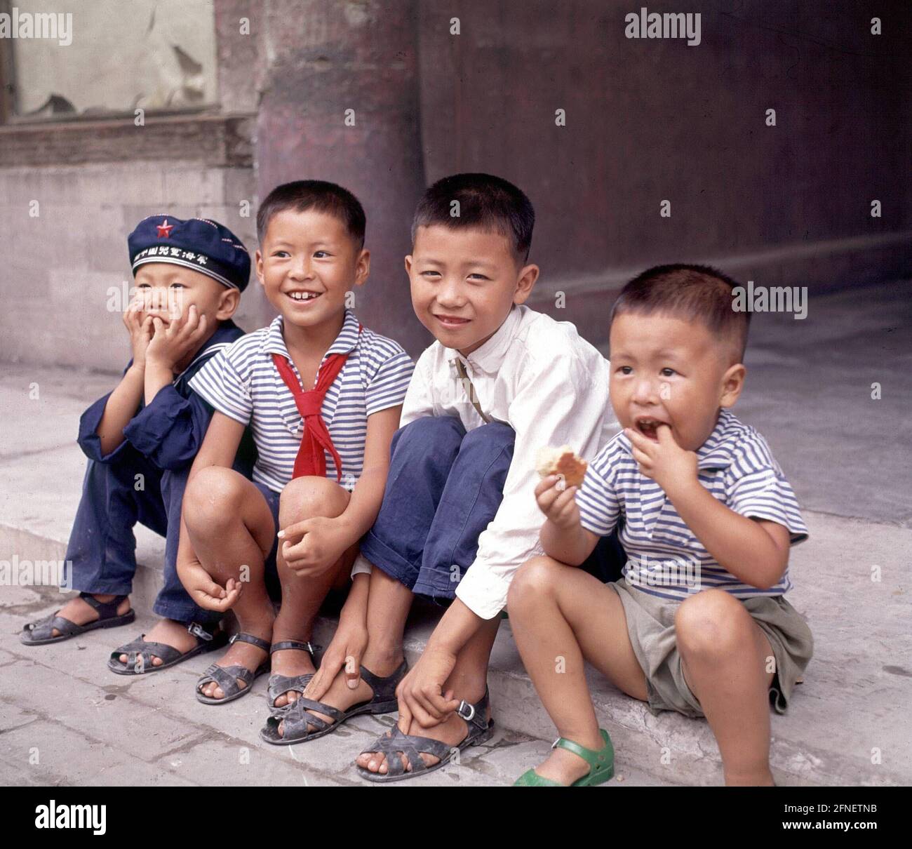 Four laughing Chinese boys. [automated translation] Stock Photo - Alamy