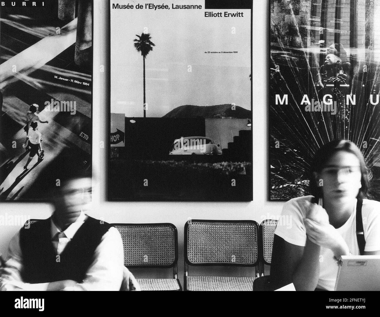 Two people are sitting in the conference room of 'Magnum Photos'. Three ...