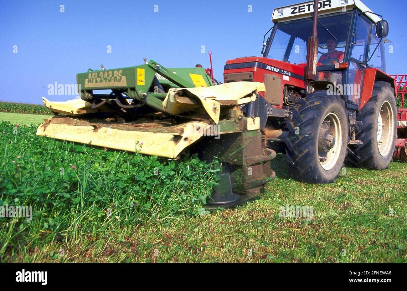 Green fodder harvest with tractor on a field near Ismaning (1997 ...