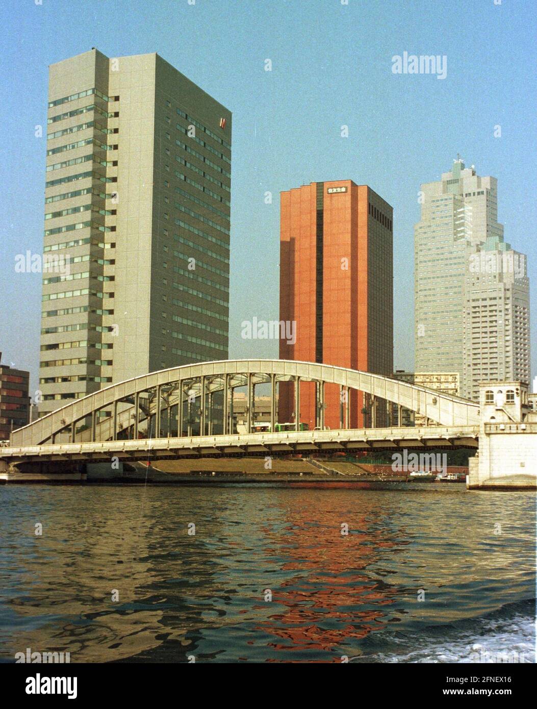 Skyscrapers and bridge over the Sumido River in Tokyo. [automated ...
