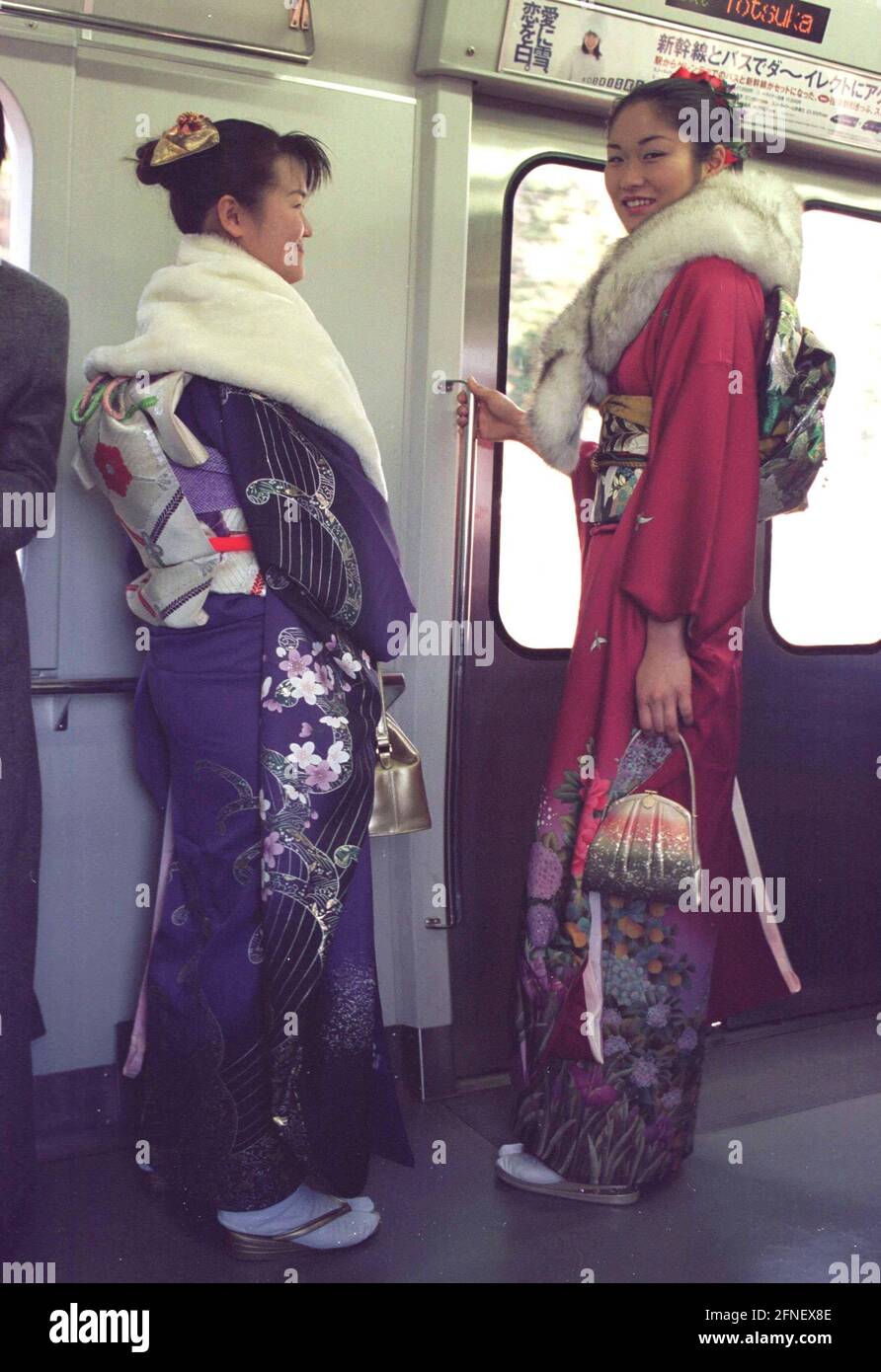 Japanese women in kimono on train to Kamakura. [automated translation ...