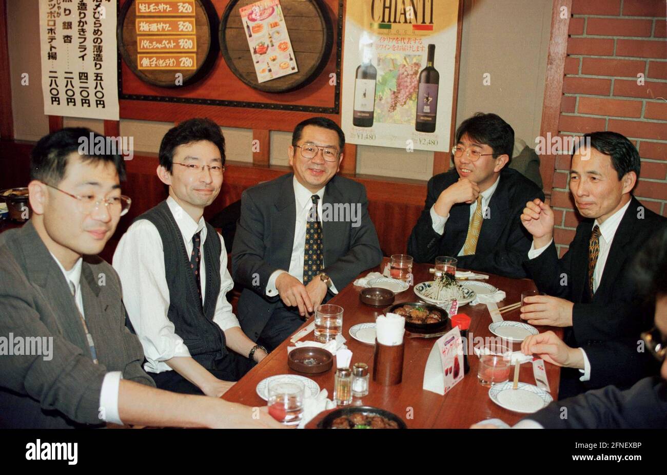Boss with staff in a Tokyo restaurant. [automated translation] Stock ...