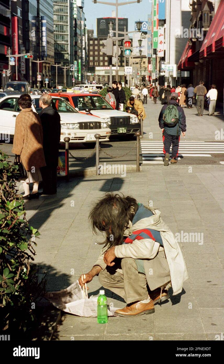 Homeless man in Tokyo's Ginza district. [automated translation] Stock ...