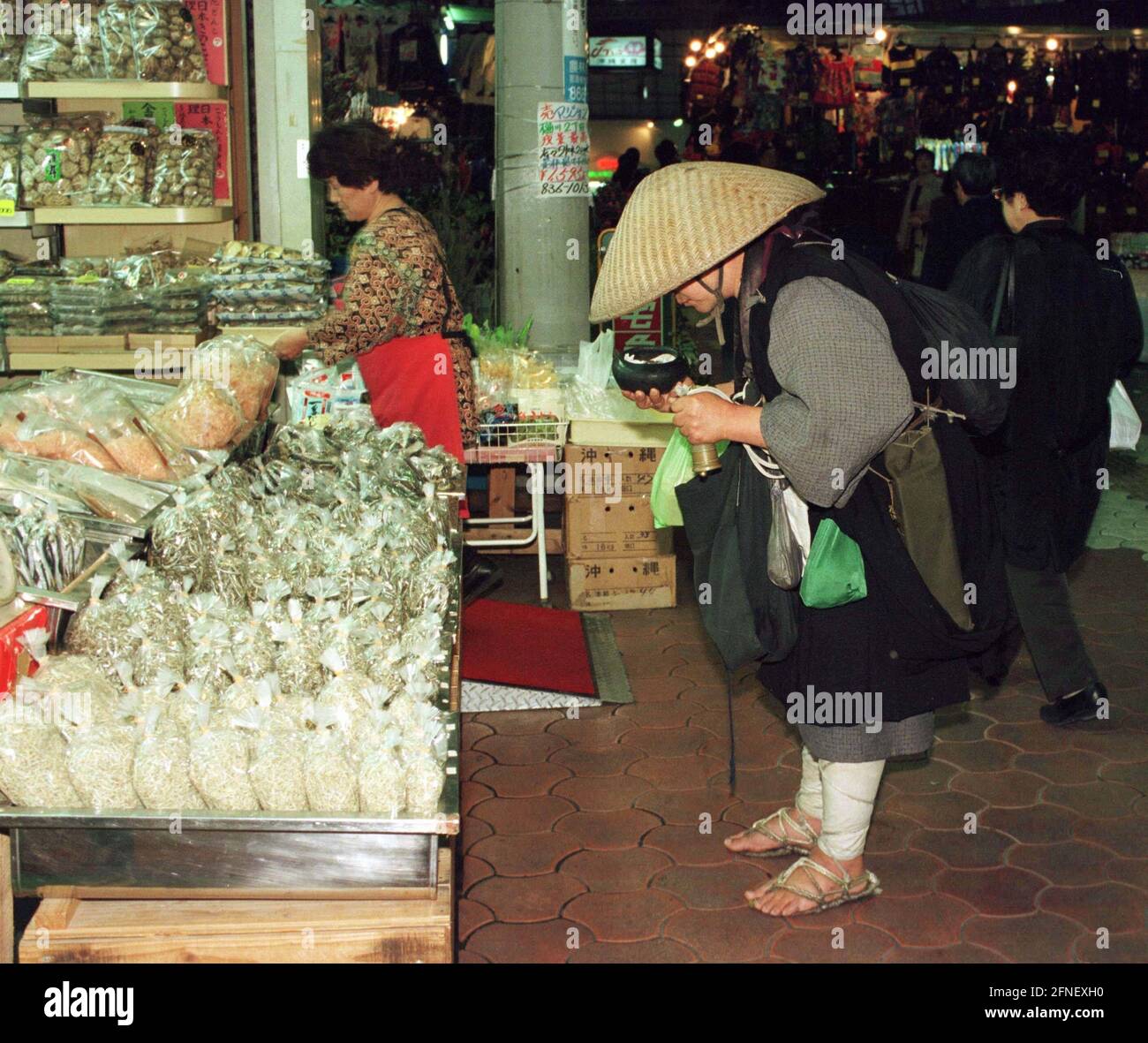 Mendicant monk in a shop in Naha on Okinawa. [automated translation ...