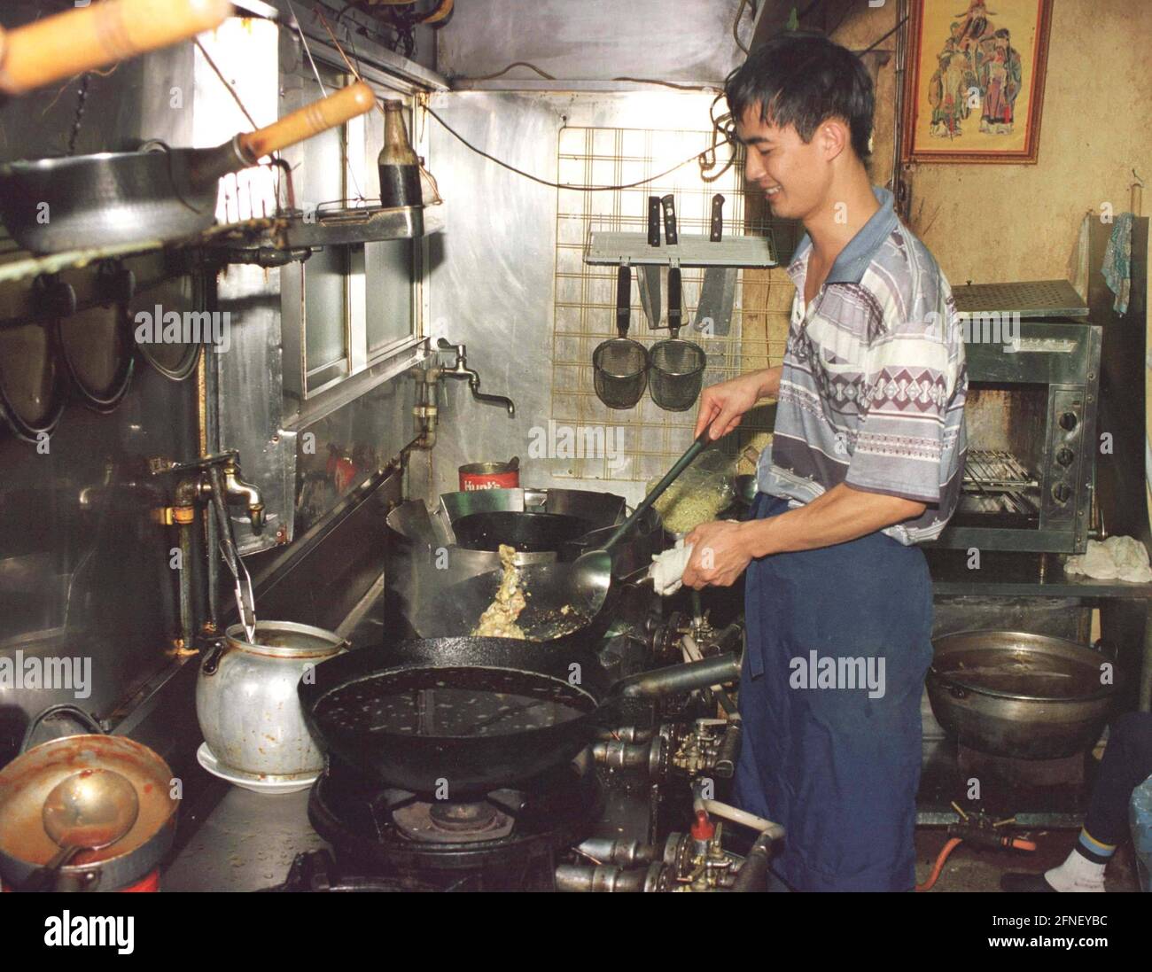 Japanese cooking in a restaurant kitchen on Okinawa. [automated ...