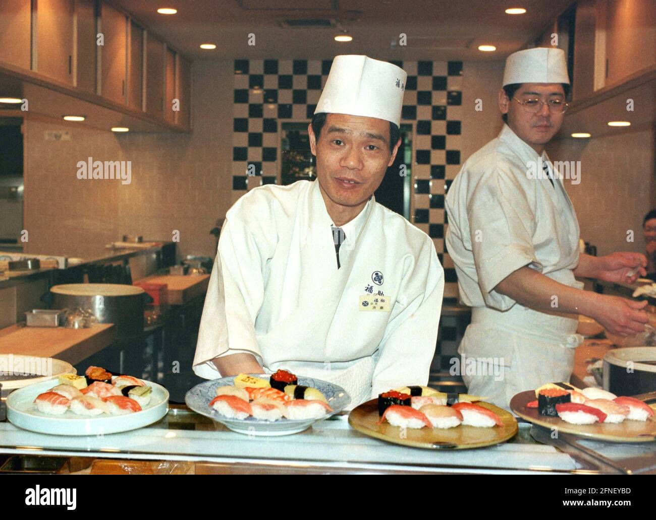 Chefs at a sushi restaurant in Tokyo. [automated translation] Stock ...