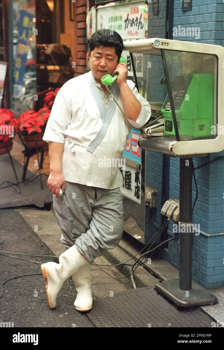 Japanese in Tokyo talking on the phone. [automated translation] Stock ...