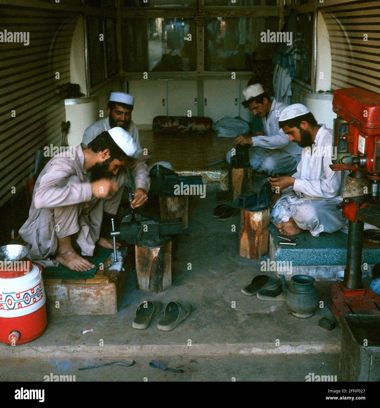 Men making weapons in a workshop. [automated translation] Stock Photo ...