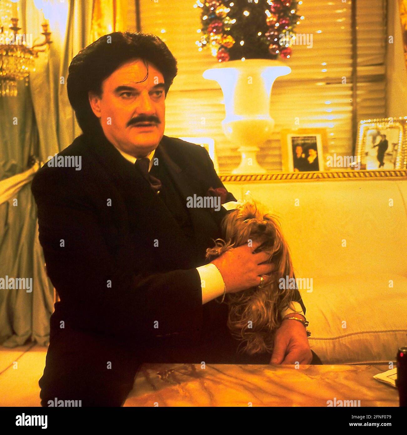 Fashion designer Rudolf Moshammer with his dog Daisy in the fashion ...