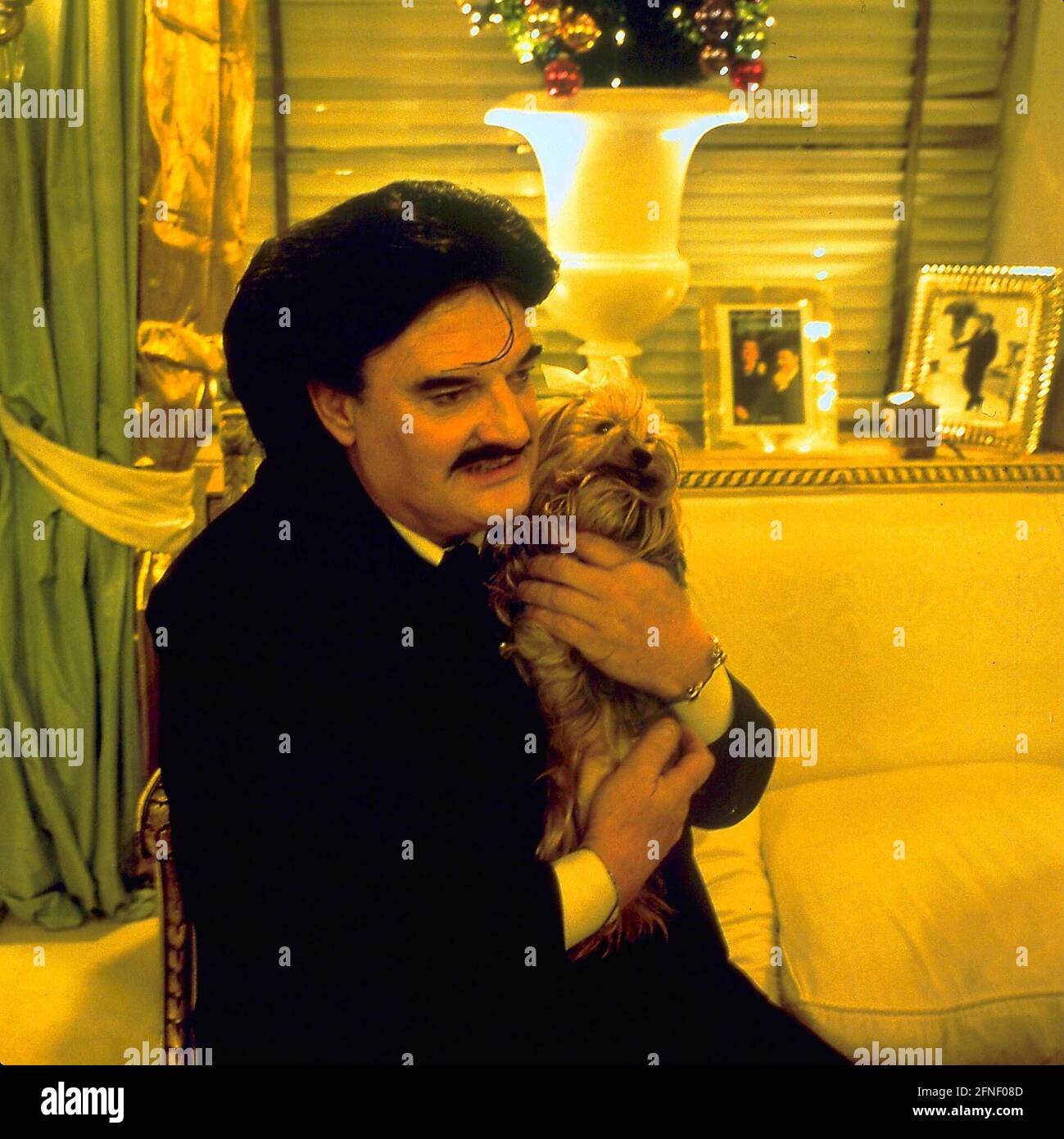 Fashion designer Rudolf Moshammer with his dog Daisy in the fashion ...