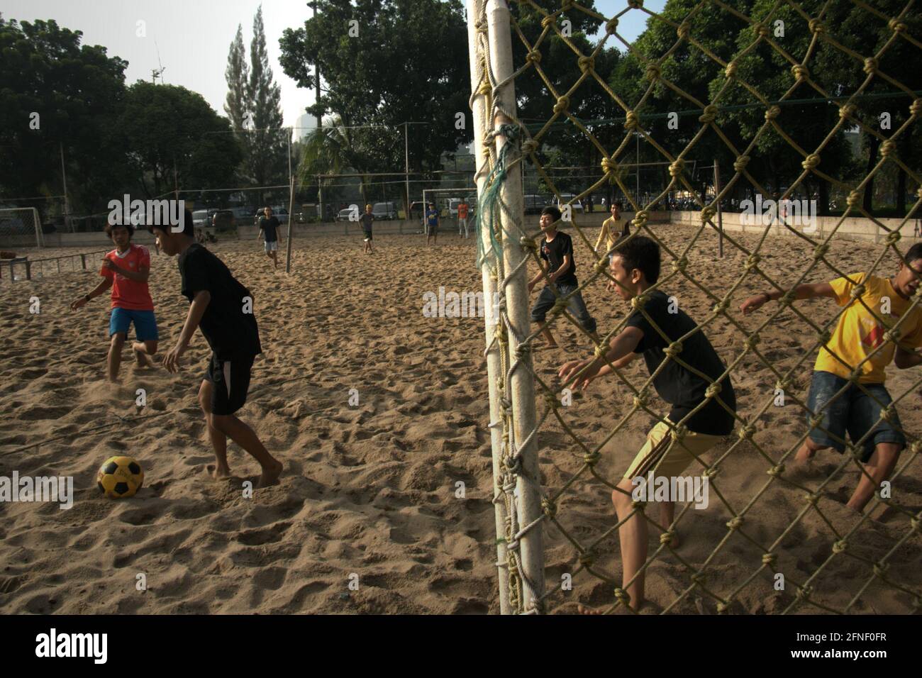 Football in sand hi-res stock photography and images - Alamy