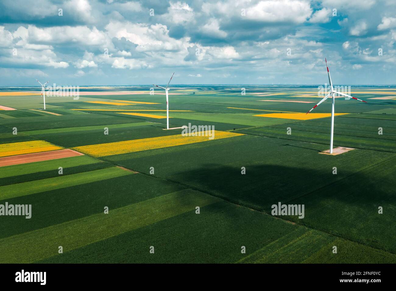Aerial view of wind turbines on modern wind farm from drone pov, high ...