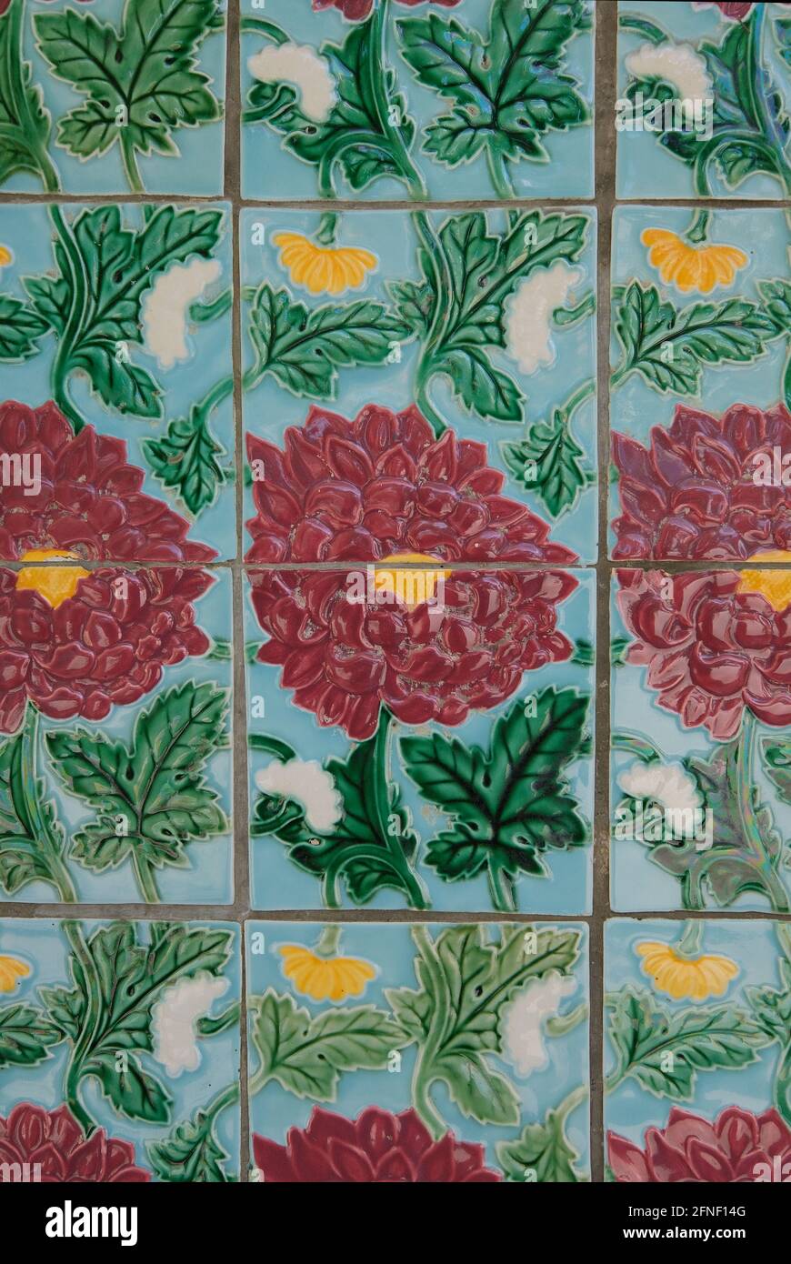 Floral ceramic tiles on walls of five foot passage along row of ...