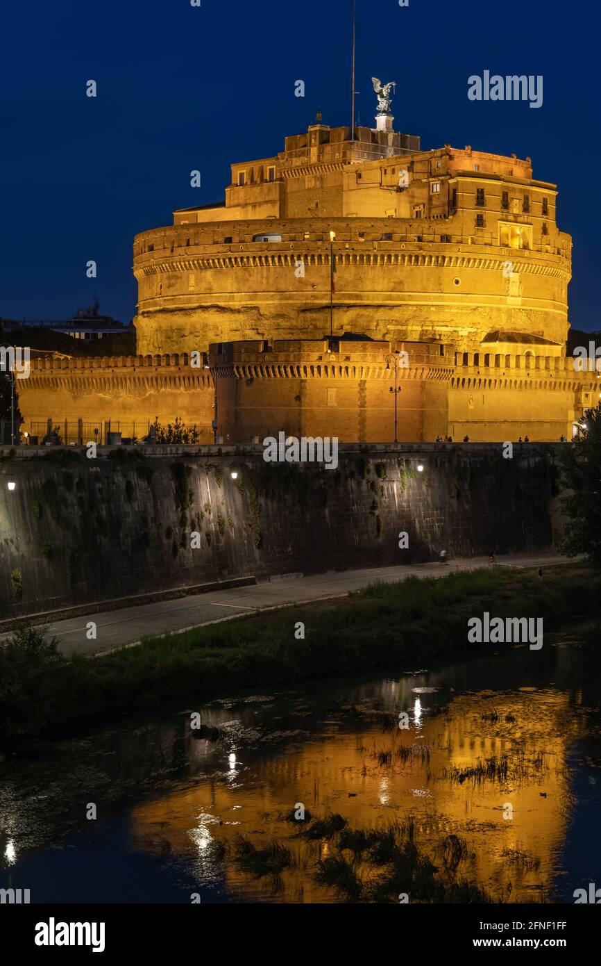 Castle of the Holy Angel (Castel Sant Angelo) by night with reflection in Tiber River, city of ...