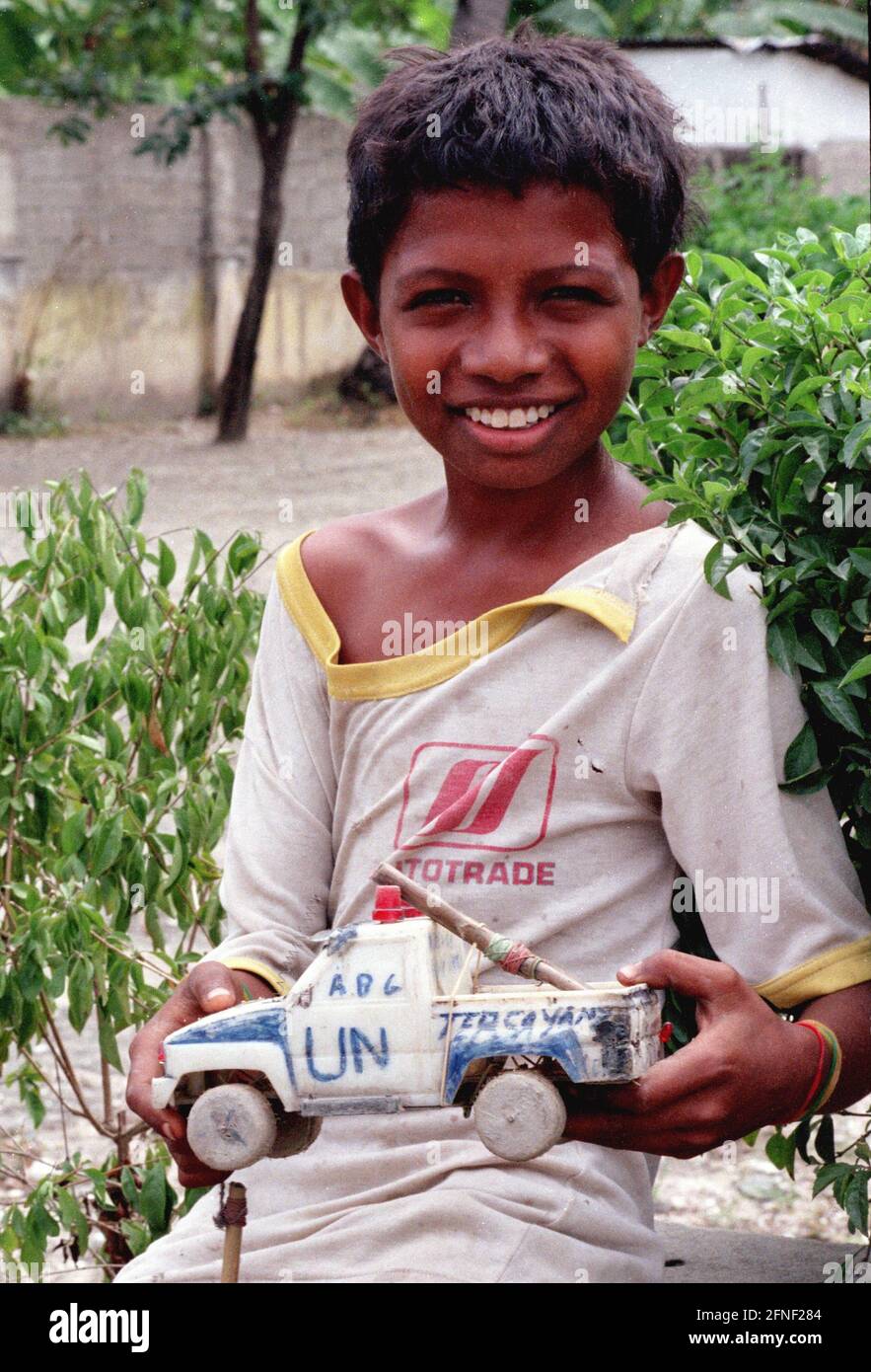 Boy with UN toy car. [automated translation] Stock Photo - Alamy