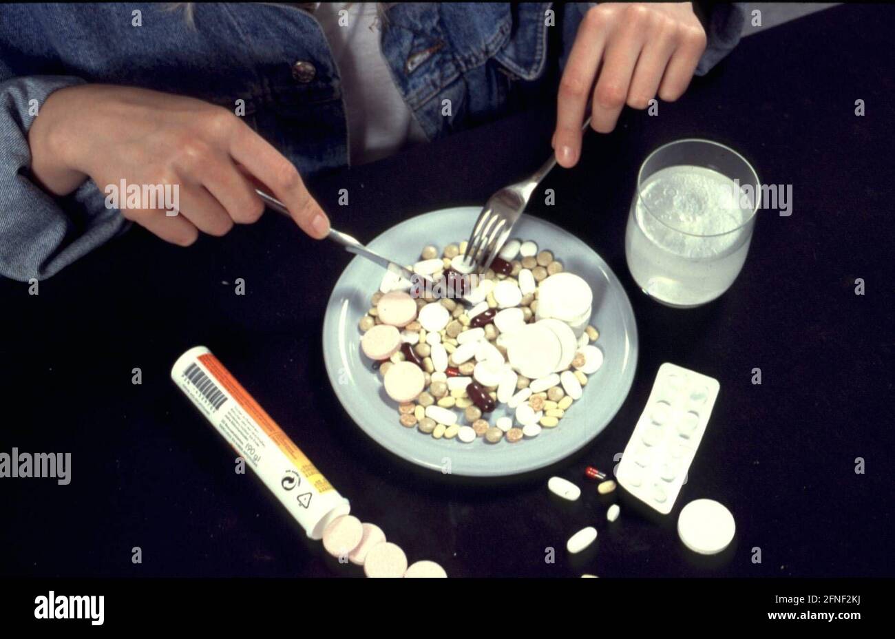 Symbolic image on the subject of drugs - tablet consumption. [automated ...
