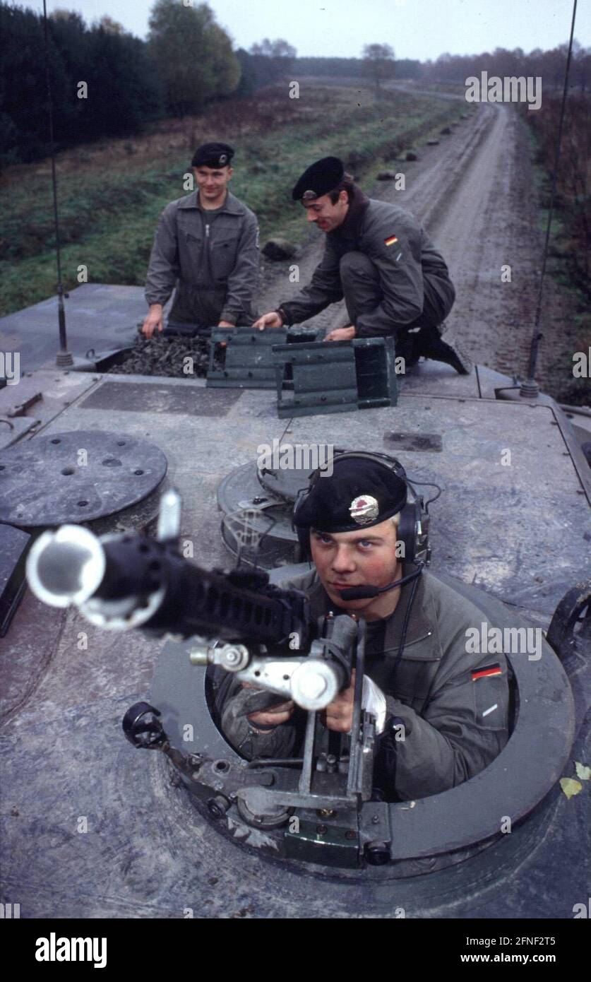 Soldiers of a Bundeswehr tank crew on maneuver. In the foreground, the ...