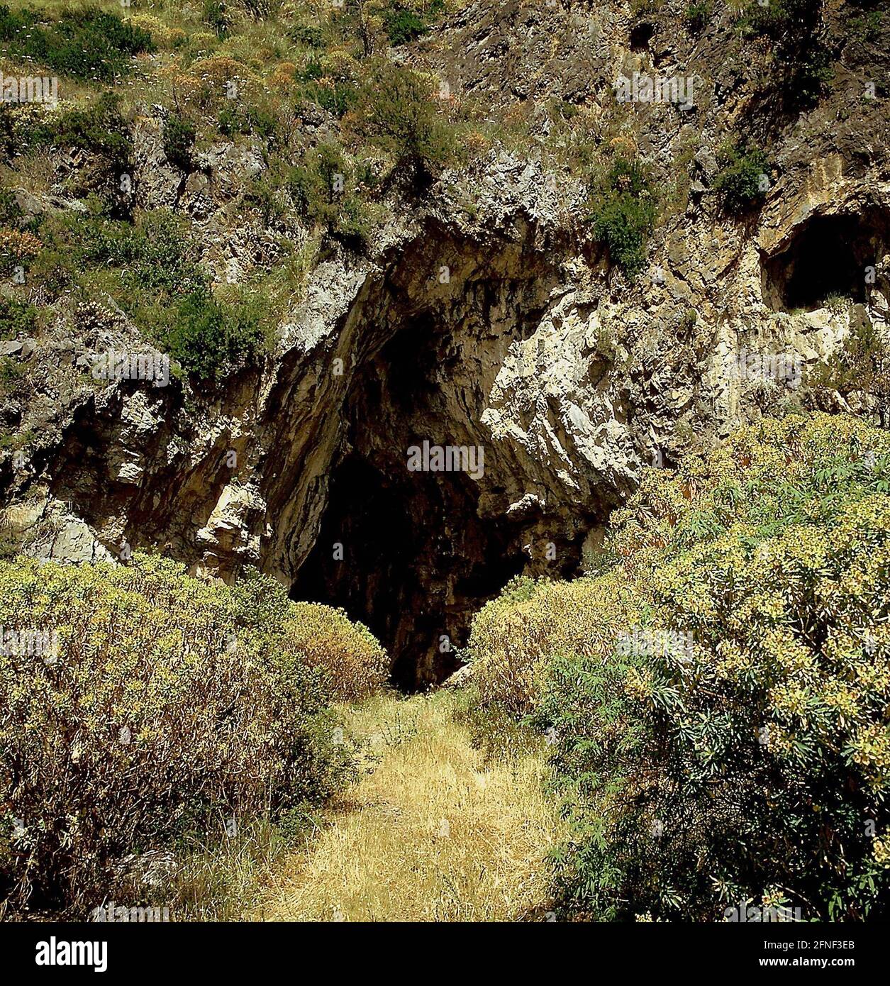 Caves in the tufa escarpment at Marina di Camerola on the Cilento coast ...