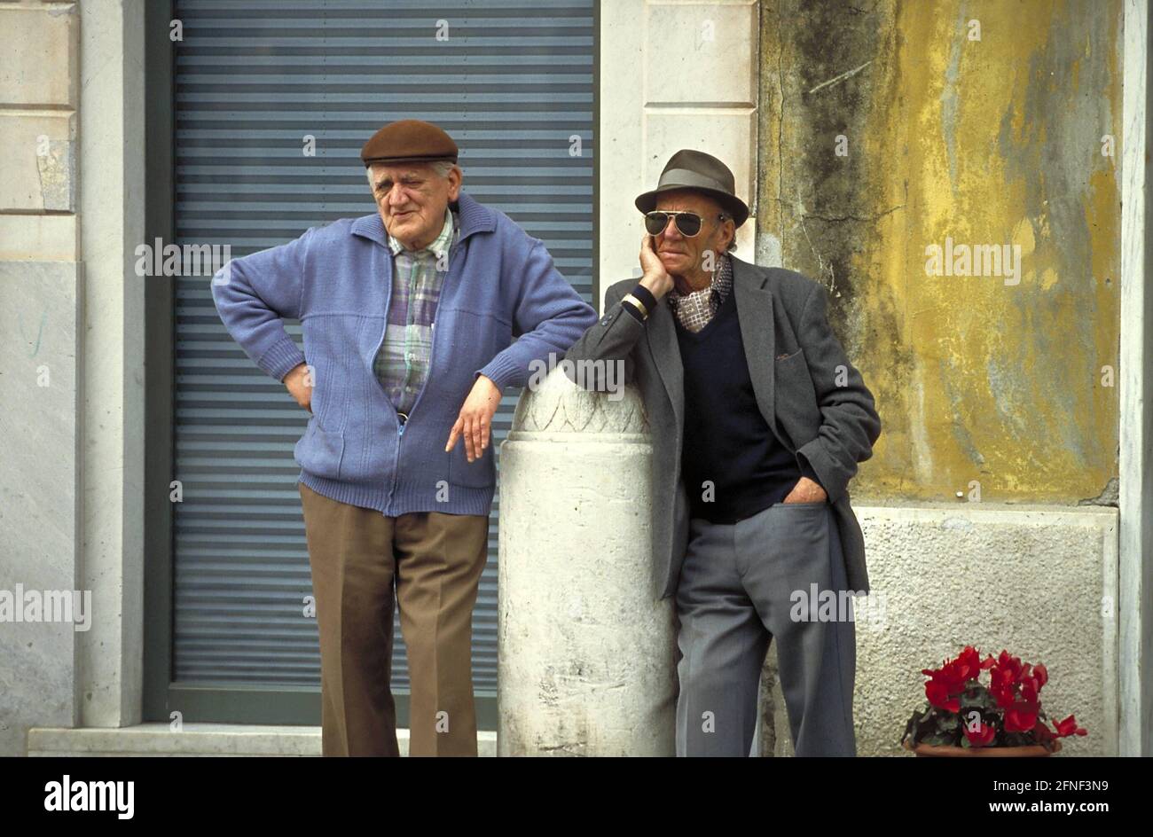 Two old men watching passers-by in Carrara. [automated translation ...