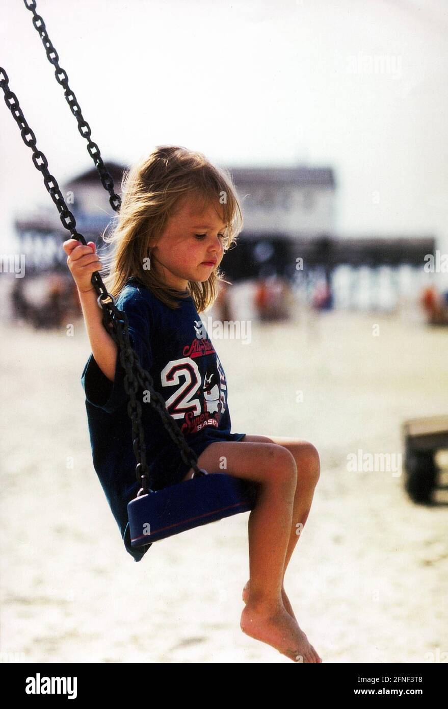 A little girl is swinging on the beach. [automated translation] Stock ...
