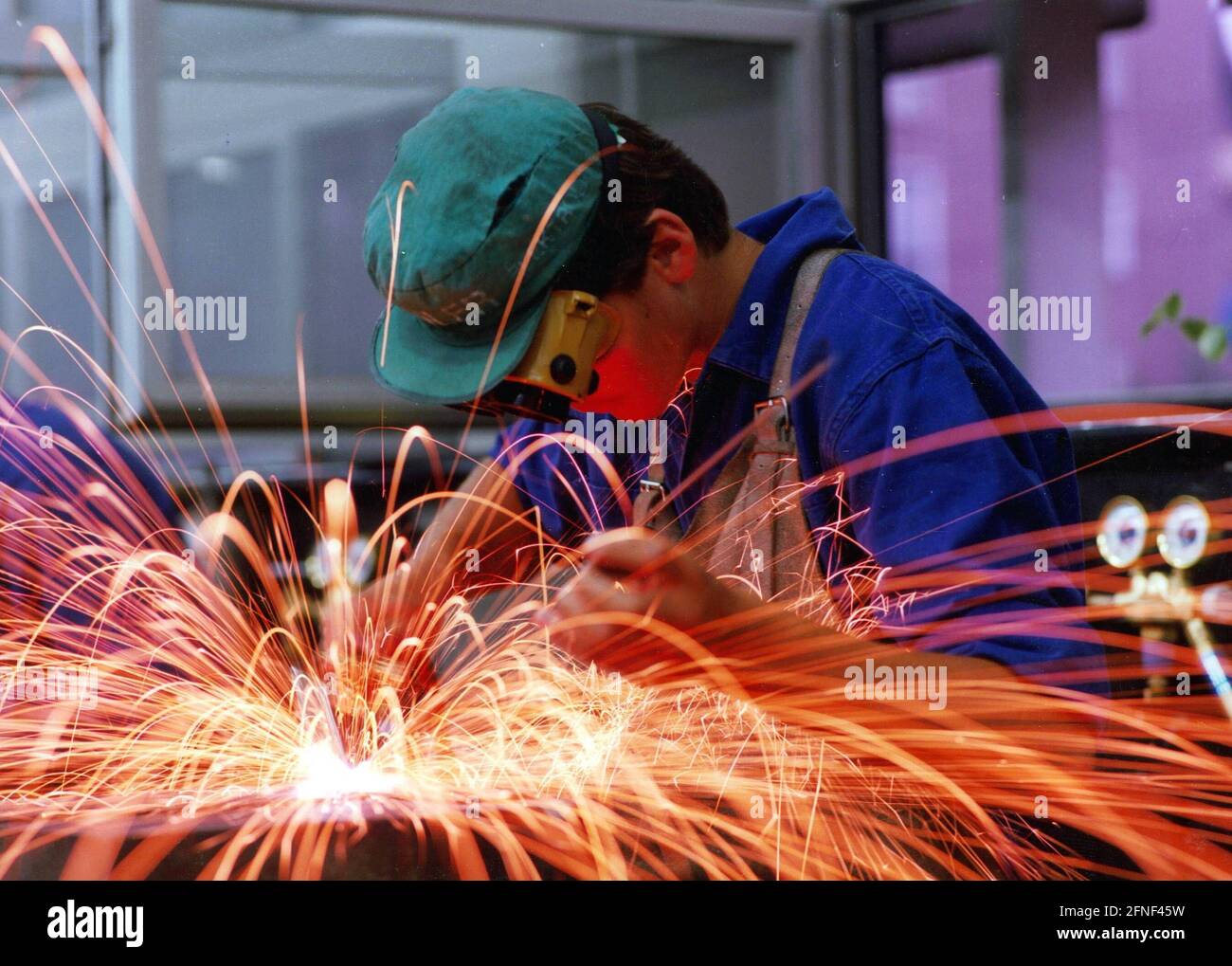 Industrial workers during welding activities. [automated translation ...