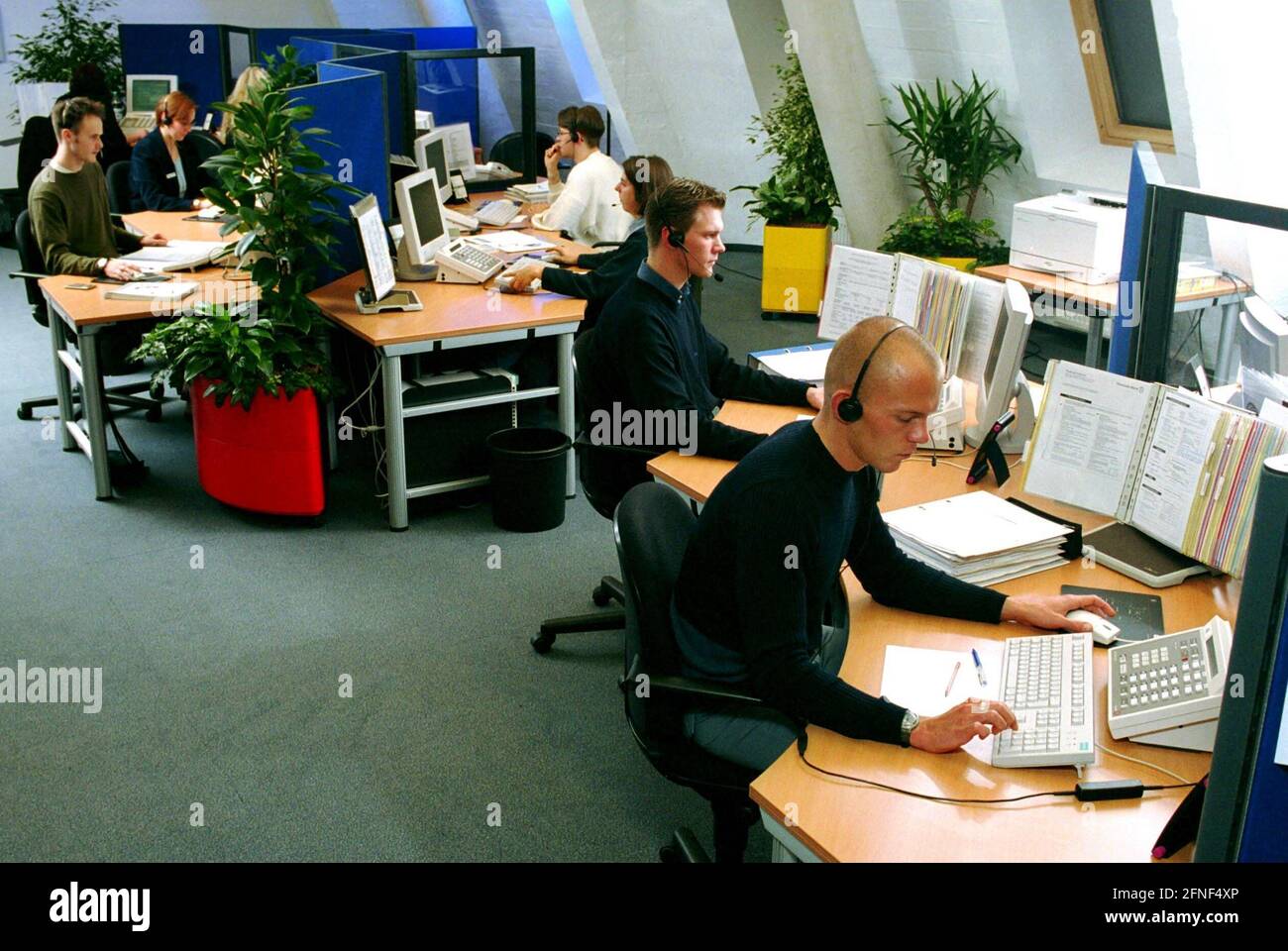 Employee in a call center of Deutsche Bank 24 in Bonn. [automated ...
