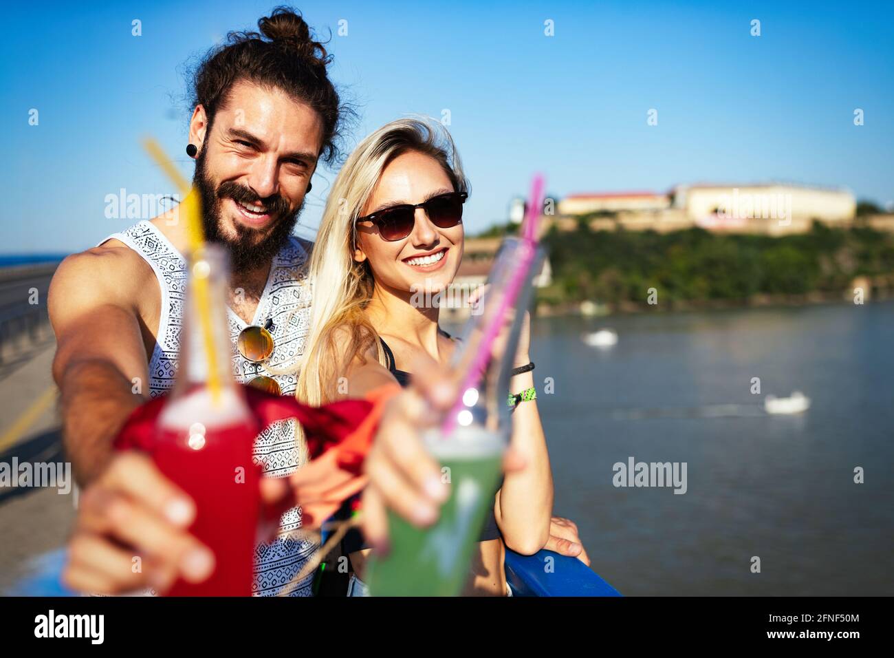 Group of friends having fun and hanging out outdoors Stock Photo - Alamy