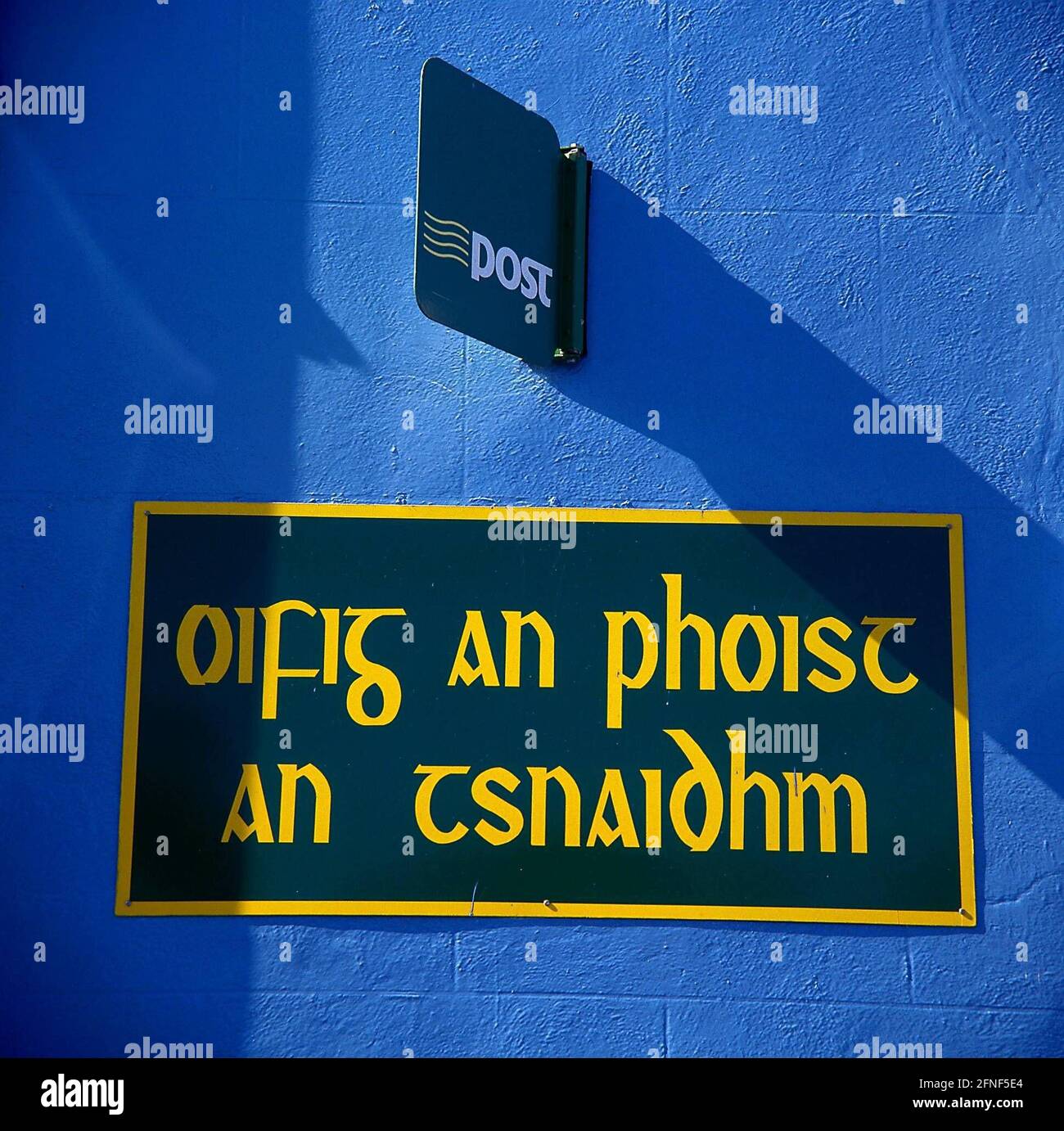 Post office sign in Gaelic along the Ring of Kerry. [automated ...