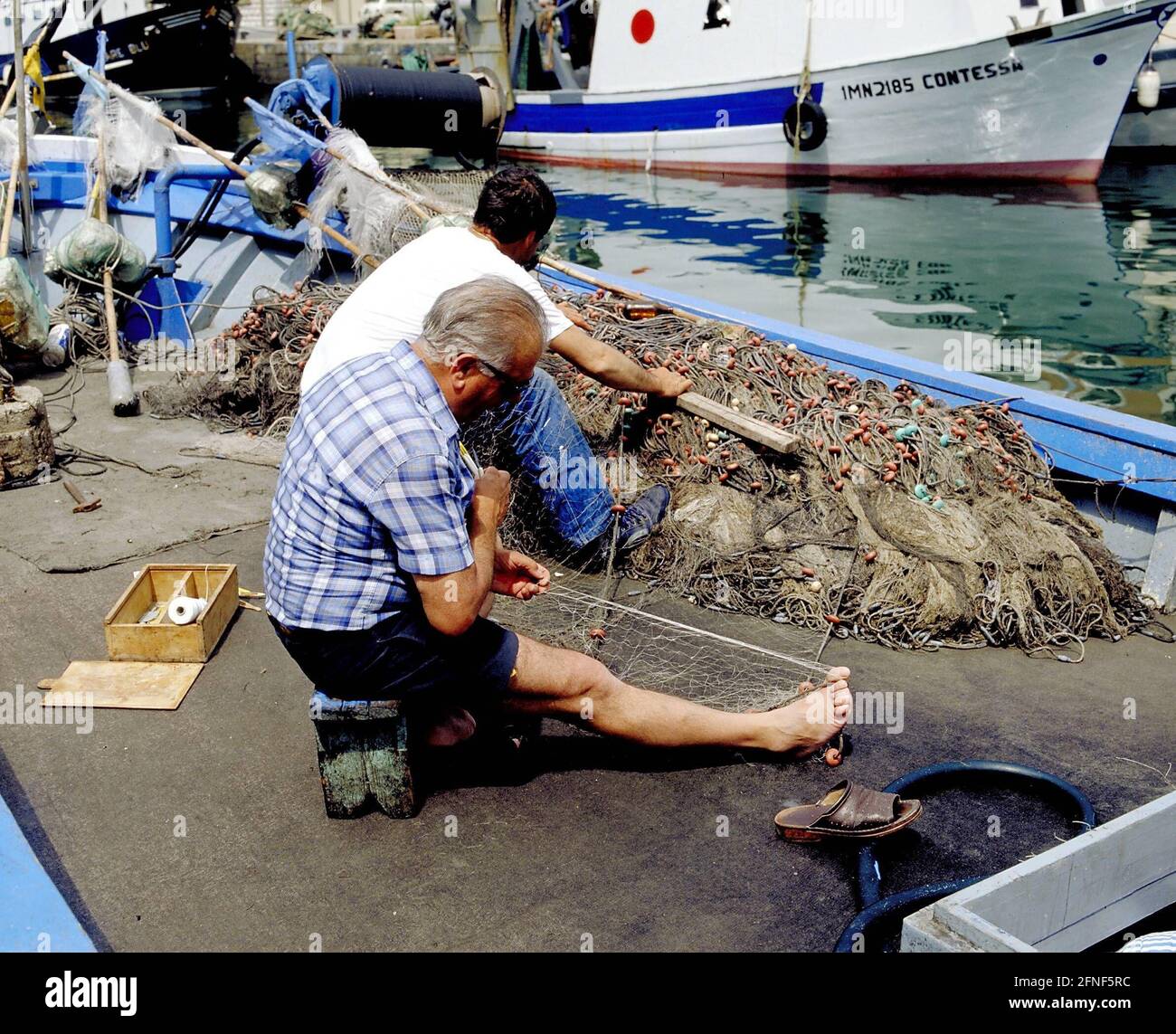 Mending nets hi-res stock photography and images - Alamy