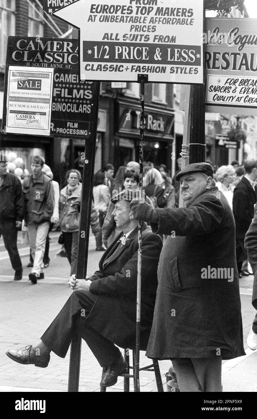 An old Irishman is working as a billboard holder in Dublin's city ...