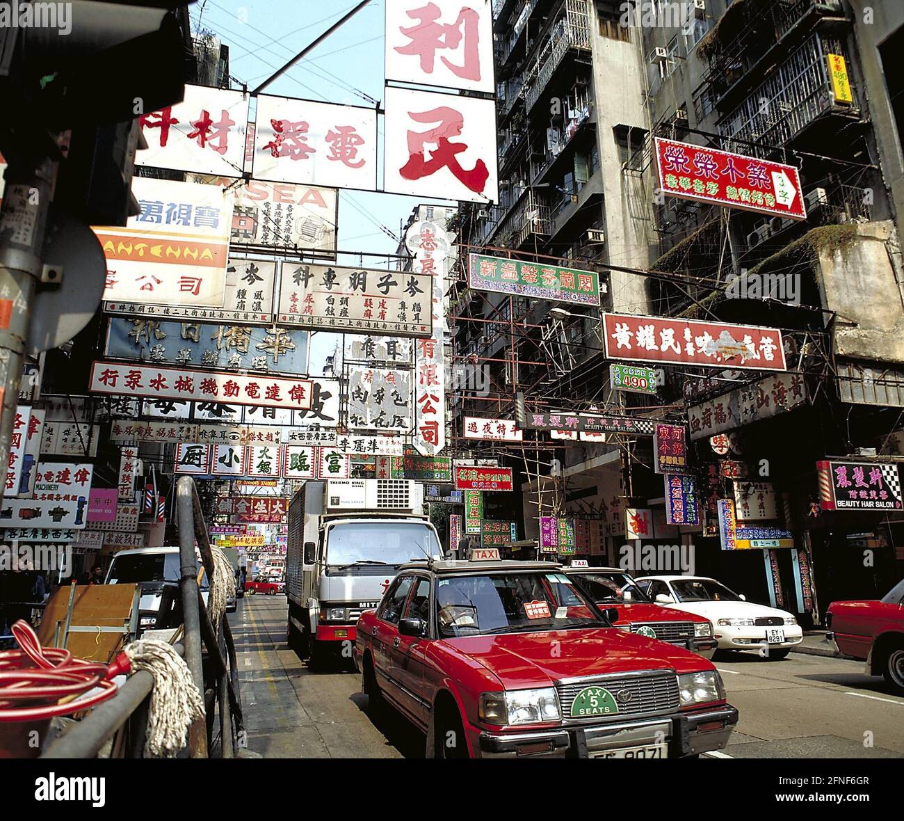 Shopping street with a lot of advertising in Mong Kok (Kowloon ...