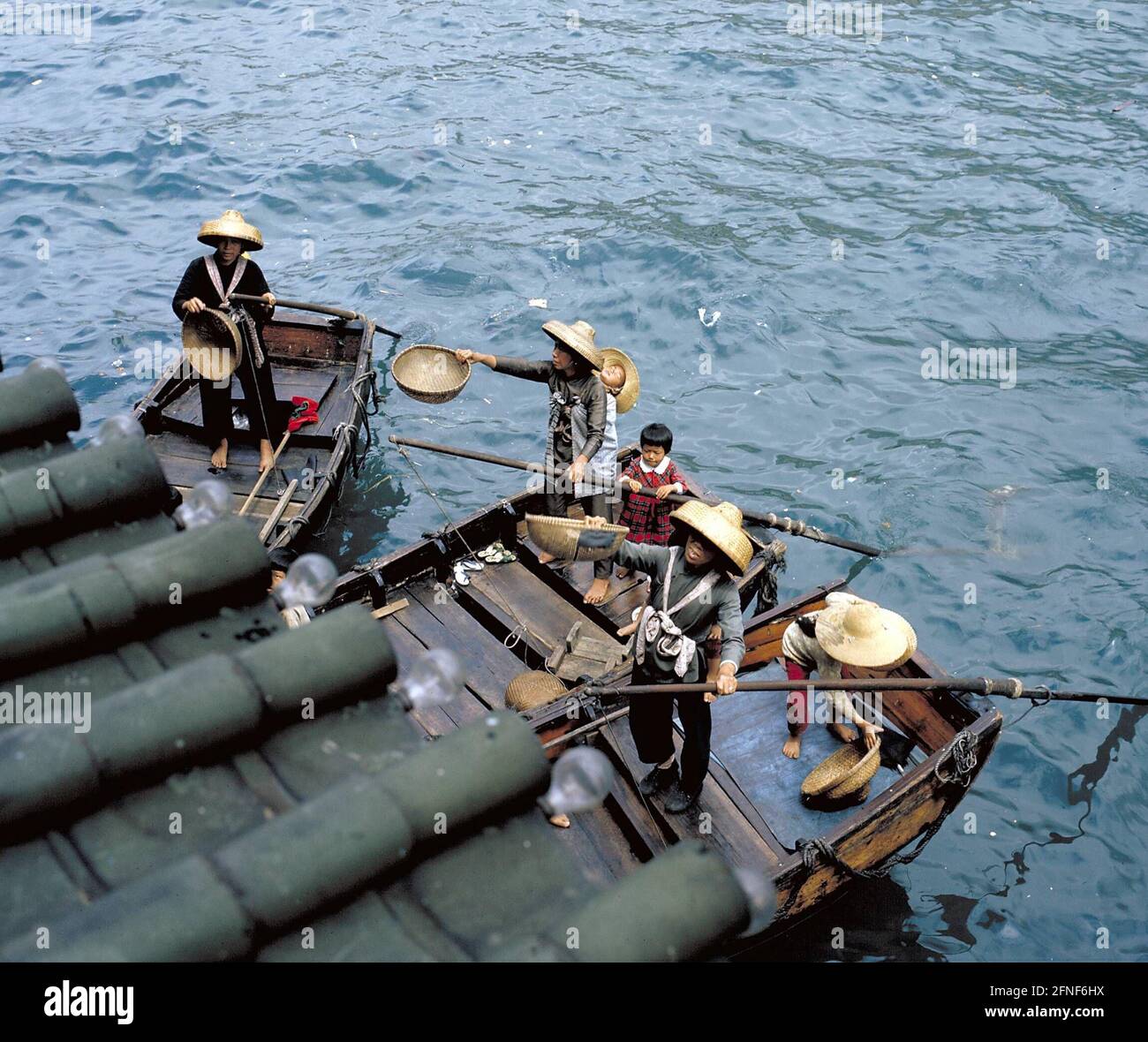 Women begging outside the 'floating restaurants' in Aberdeen harbour ...