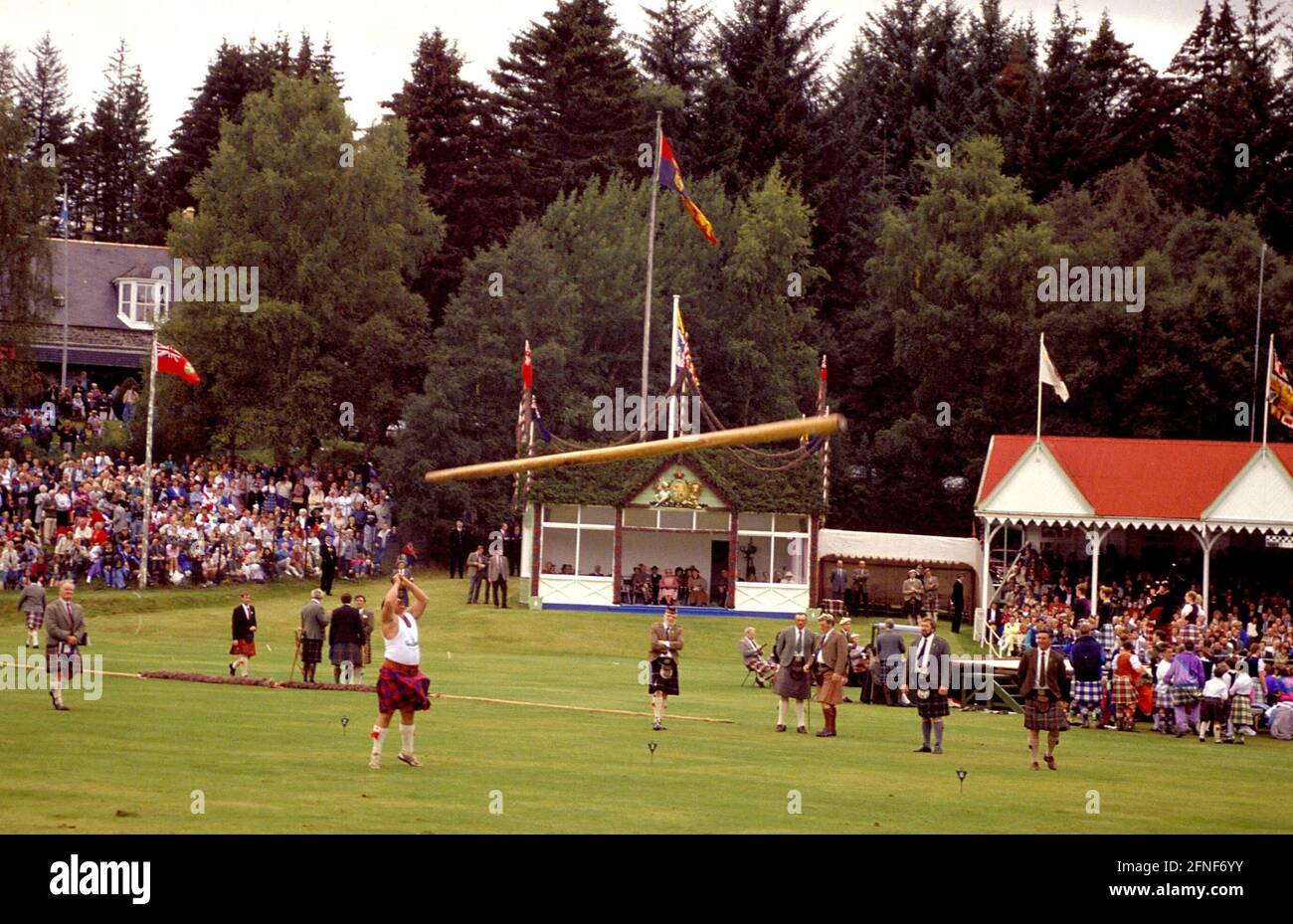 Tree trunk toss under the eyes of the Queen (in the background in the ...