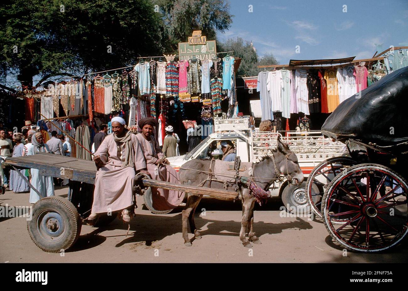 Stalls and carts at the bazaar in Edfu, Upper Egypt. [automated ...
