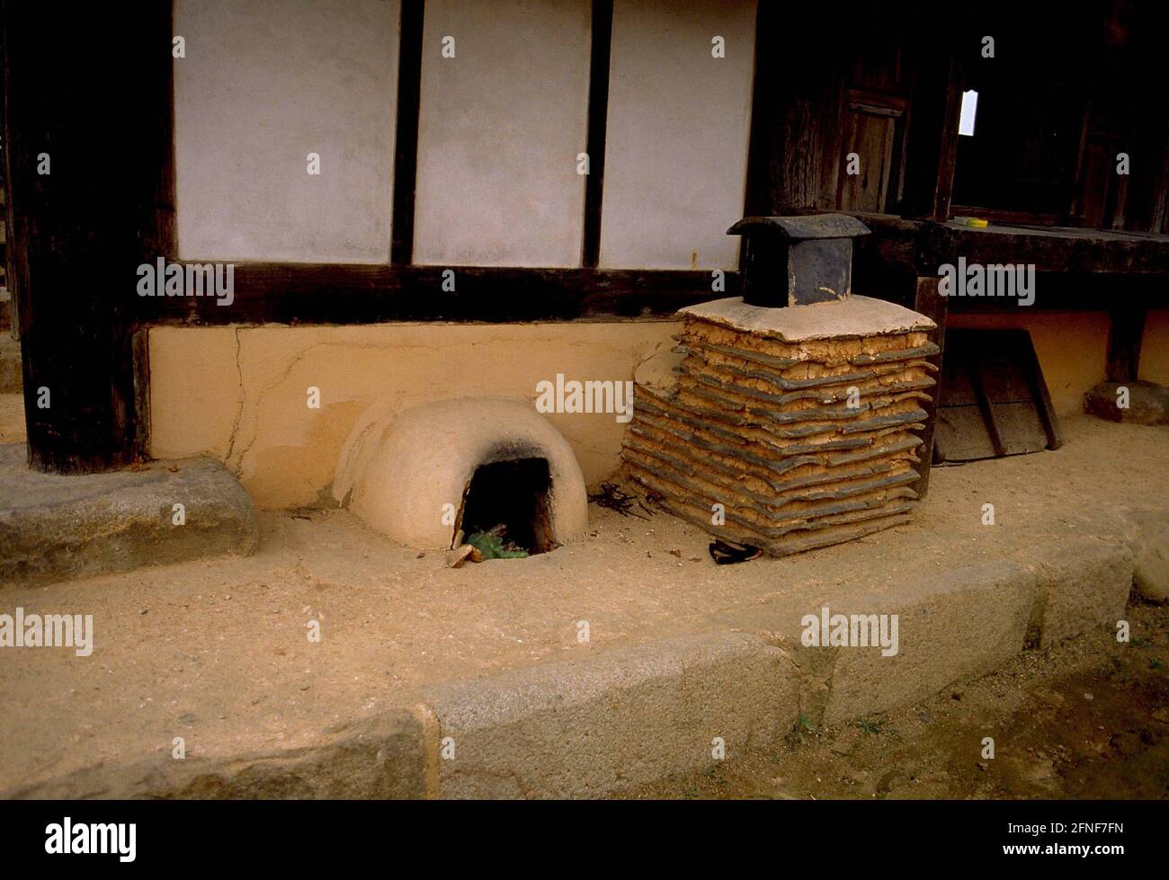 On the outside of a farmhouse in South Korea is the heating hole for ...