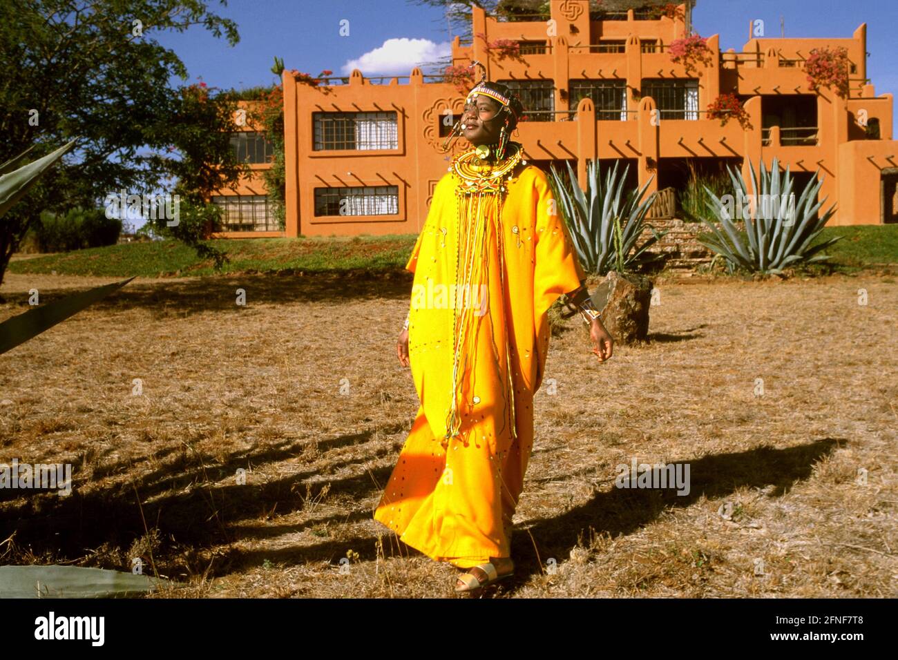 Kenyan model demonstrates African fashion in front of Fashion House ...