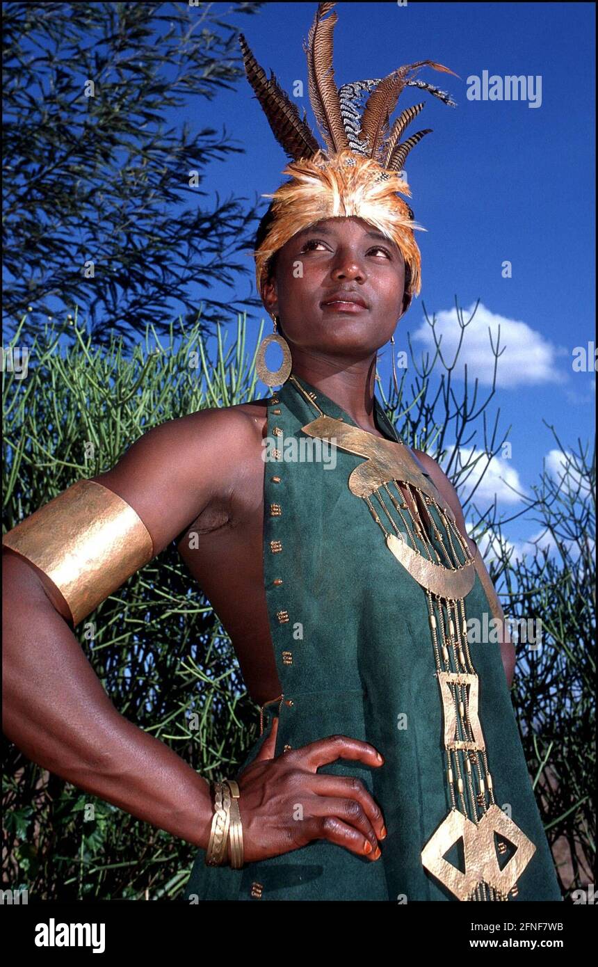 Kenyan model demonstrates African fashion in front of Fashion House ...