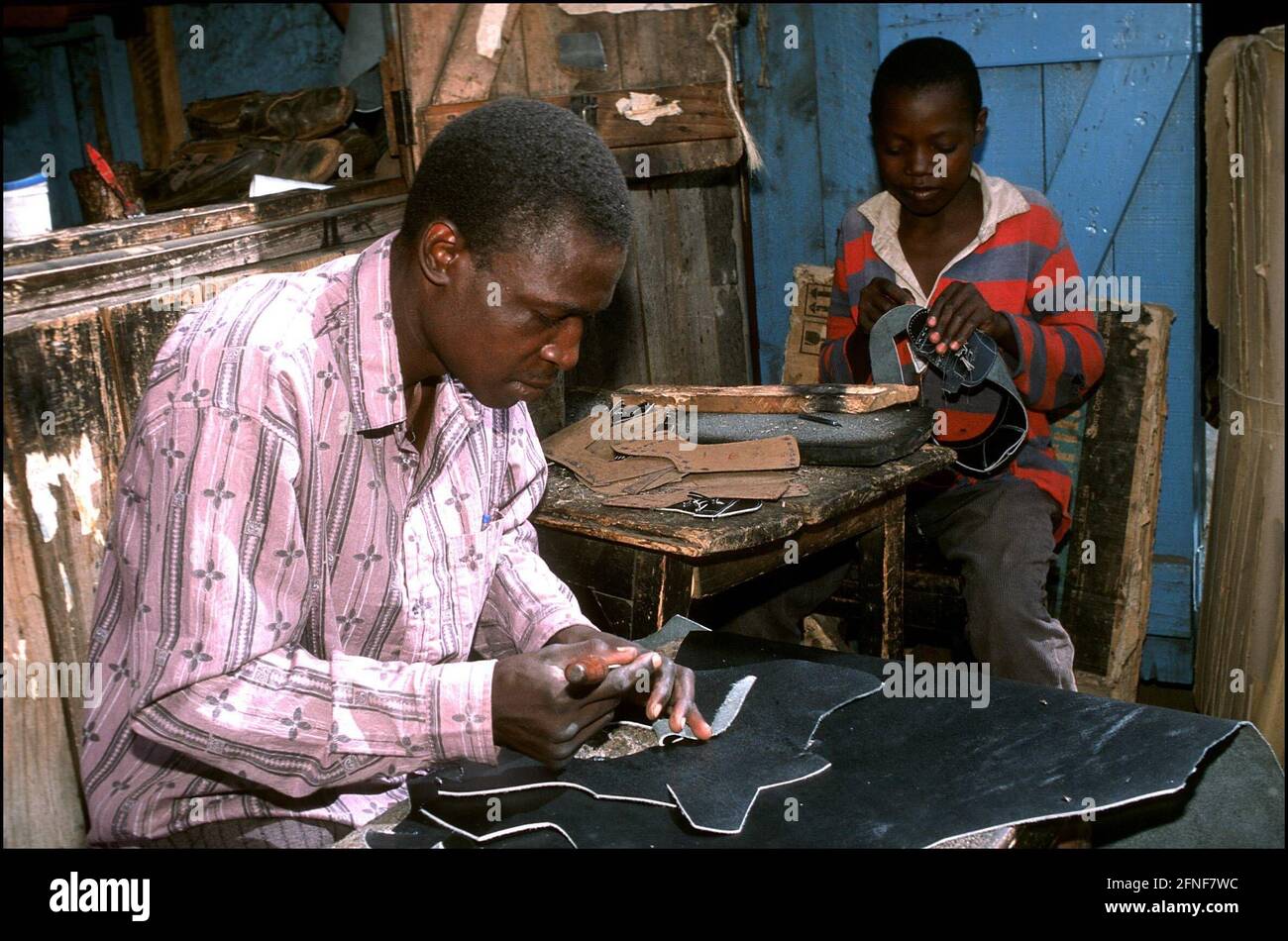 Kenyan craftsmen process leather in a small workshop in a suburb of ...