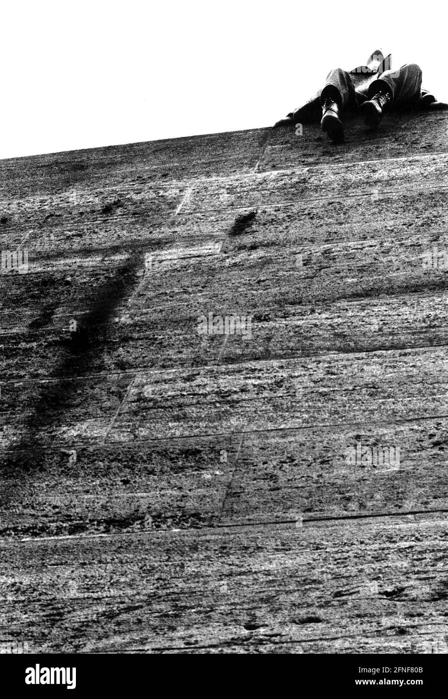 Man on a wall. [automated translation] Stock Photo - Alamy