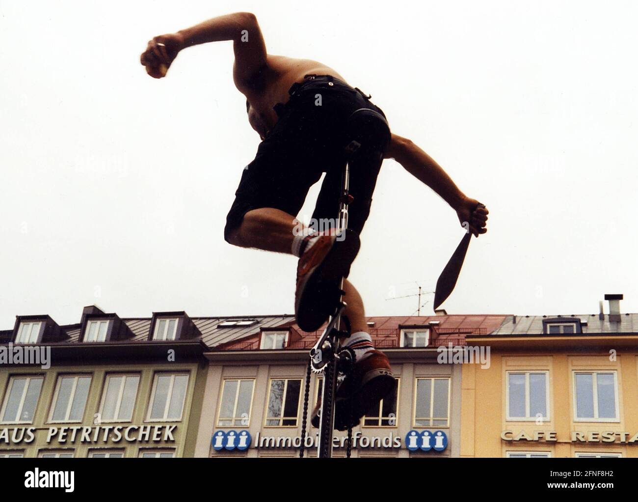 Acrobat on unicycle at the Marienplatz in Munich. [automated ...