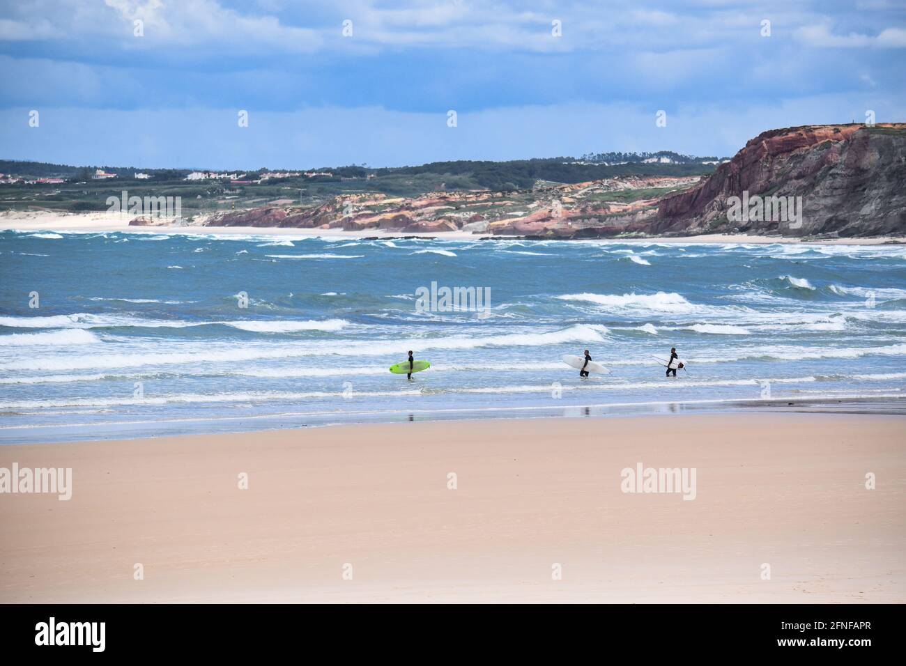Surfers with surfboards on scenic Baleal beach near Peniche, Portugal ...