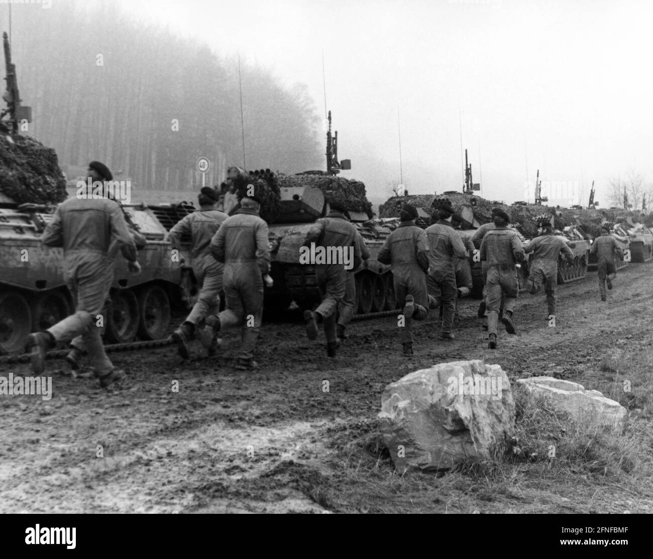 Tank crews of the Bundeswehr run to their Leopard 1 tanks during a ...