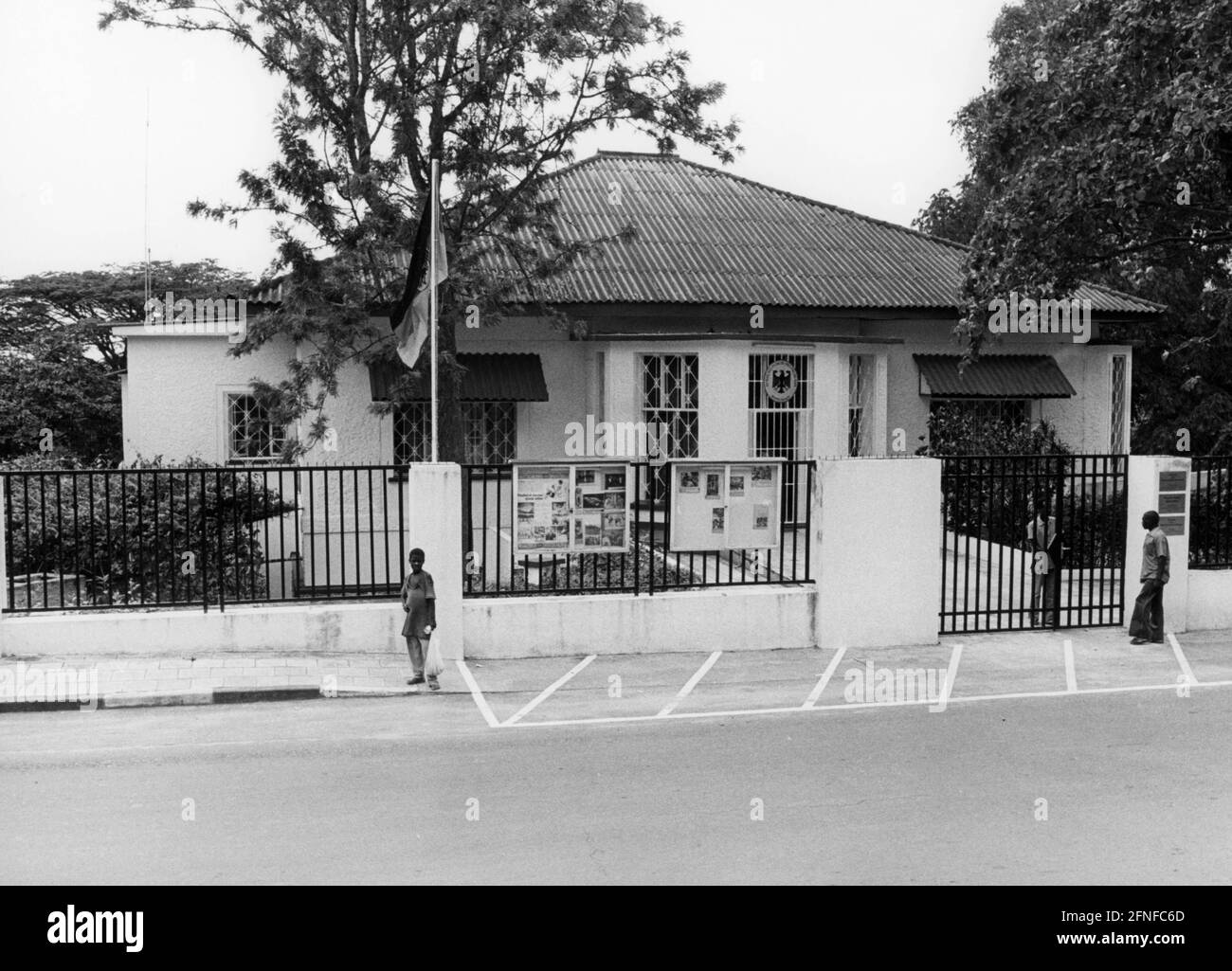 A security guard opens the gate to the German embassy in Bujumbura ...