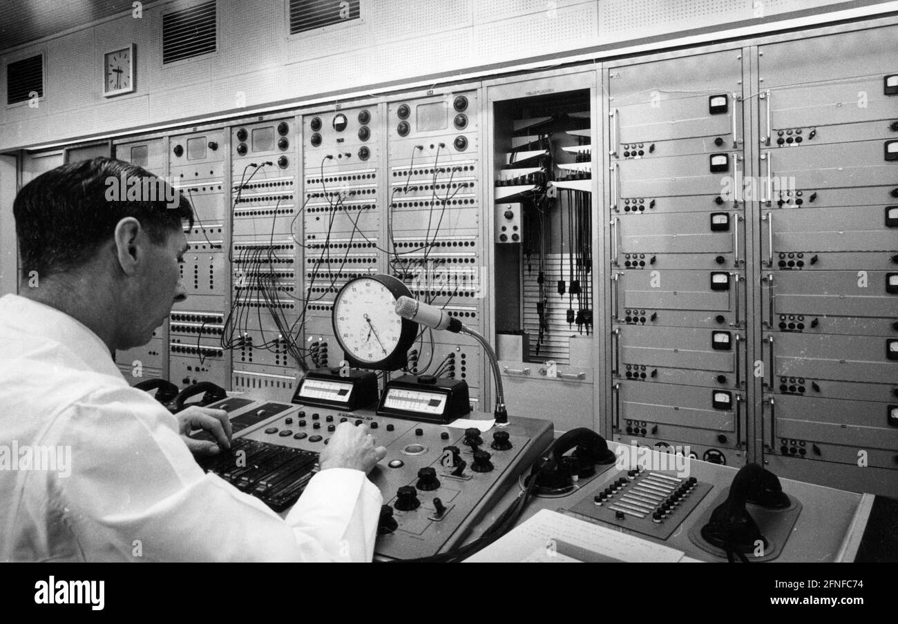 A man works in the switchboard at the Federal Press Office. [automated ...