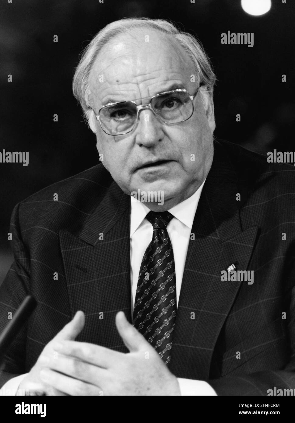 Federal Chancellor Helmut Kohl (CDU) in portrait, with clasped hands ...