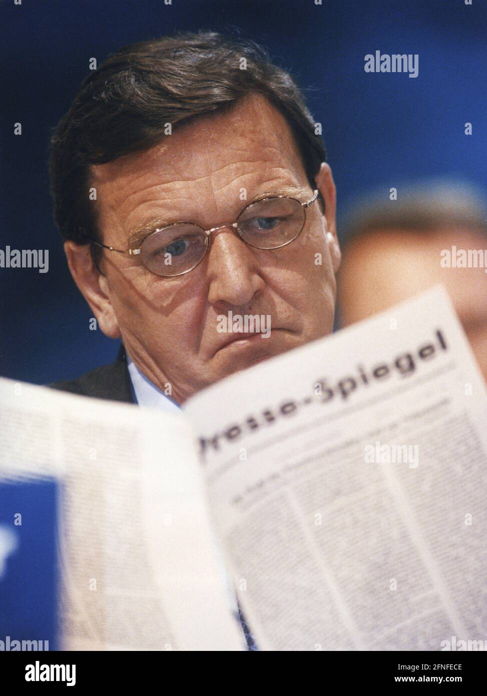 Chancellor Gerhard Schröder reading the newspaper. [automated ...