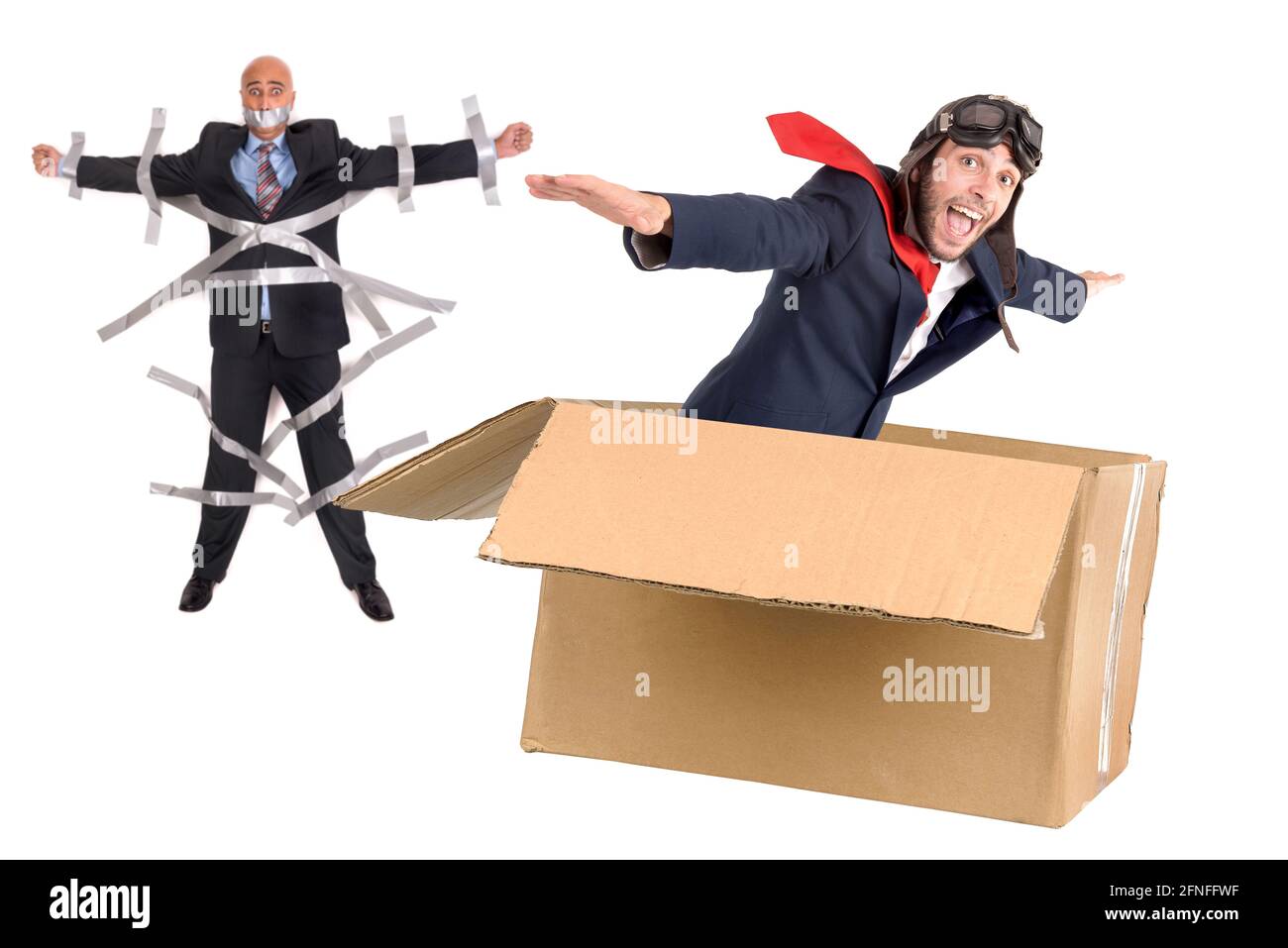 Businessman escaping, flying a carboard box isolated in white Stock ...